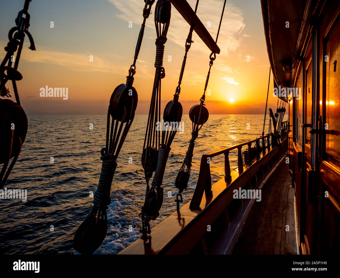 Sunset at the Sailboat deck while cruising in the Cyclades in Greece ...