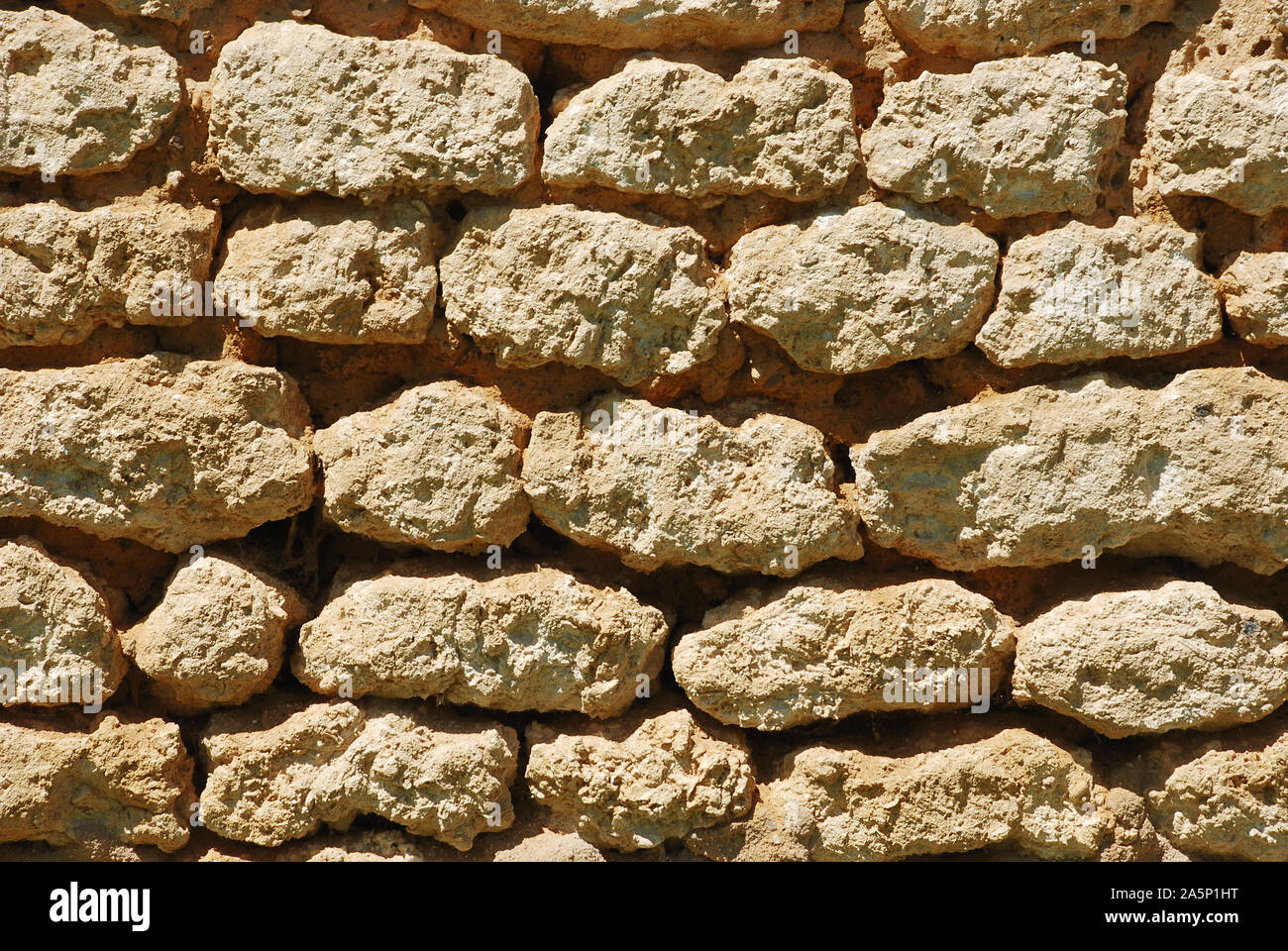 Solid wall made of stone Stock Photo - Alamy