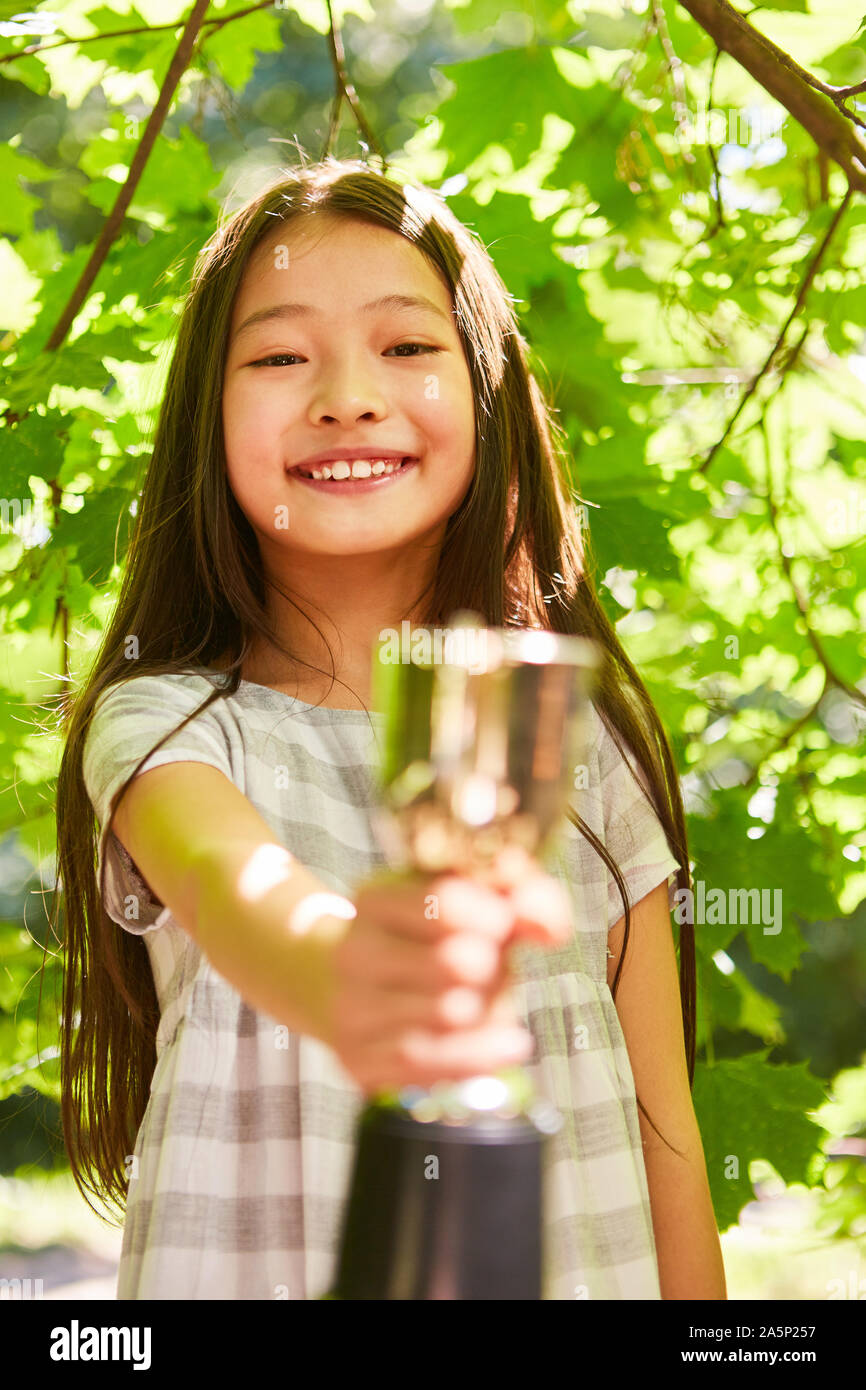 Child winner trophy hi-res stock photography and images - Alamy