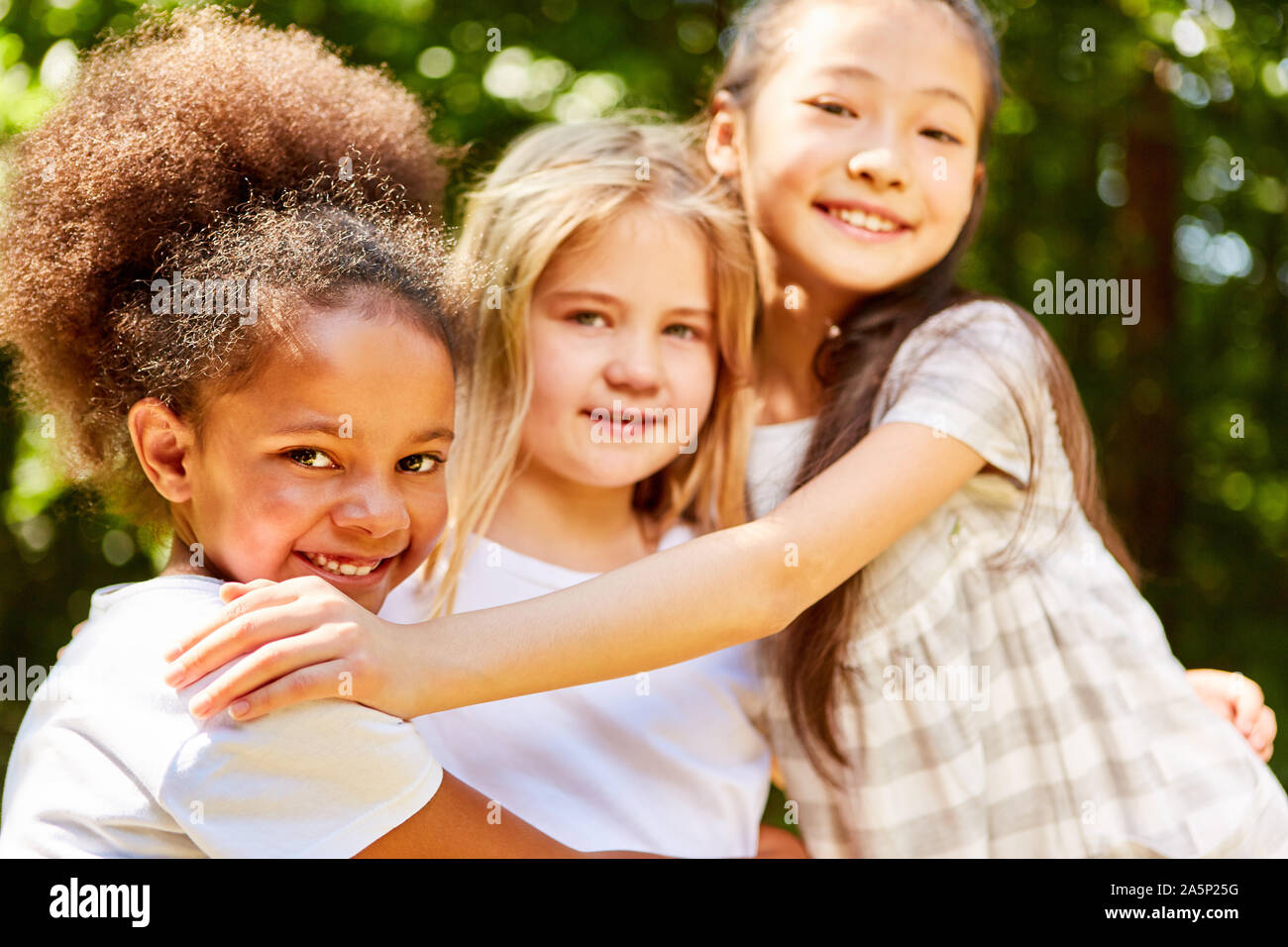Three multicultural girls together for friendship and integration Stock ...