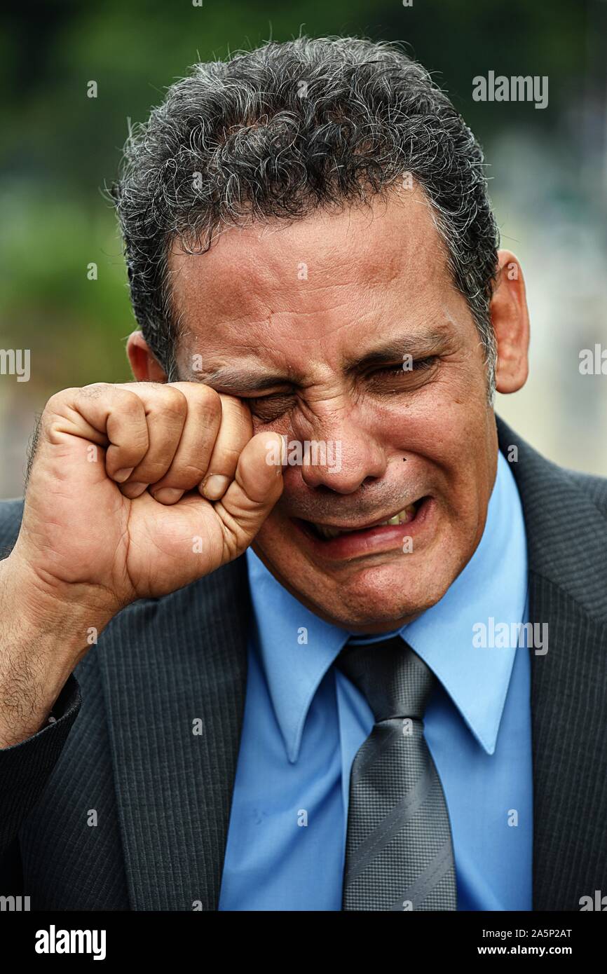 Young Colombian Business Man Crying Stock Photo - Alamy