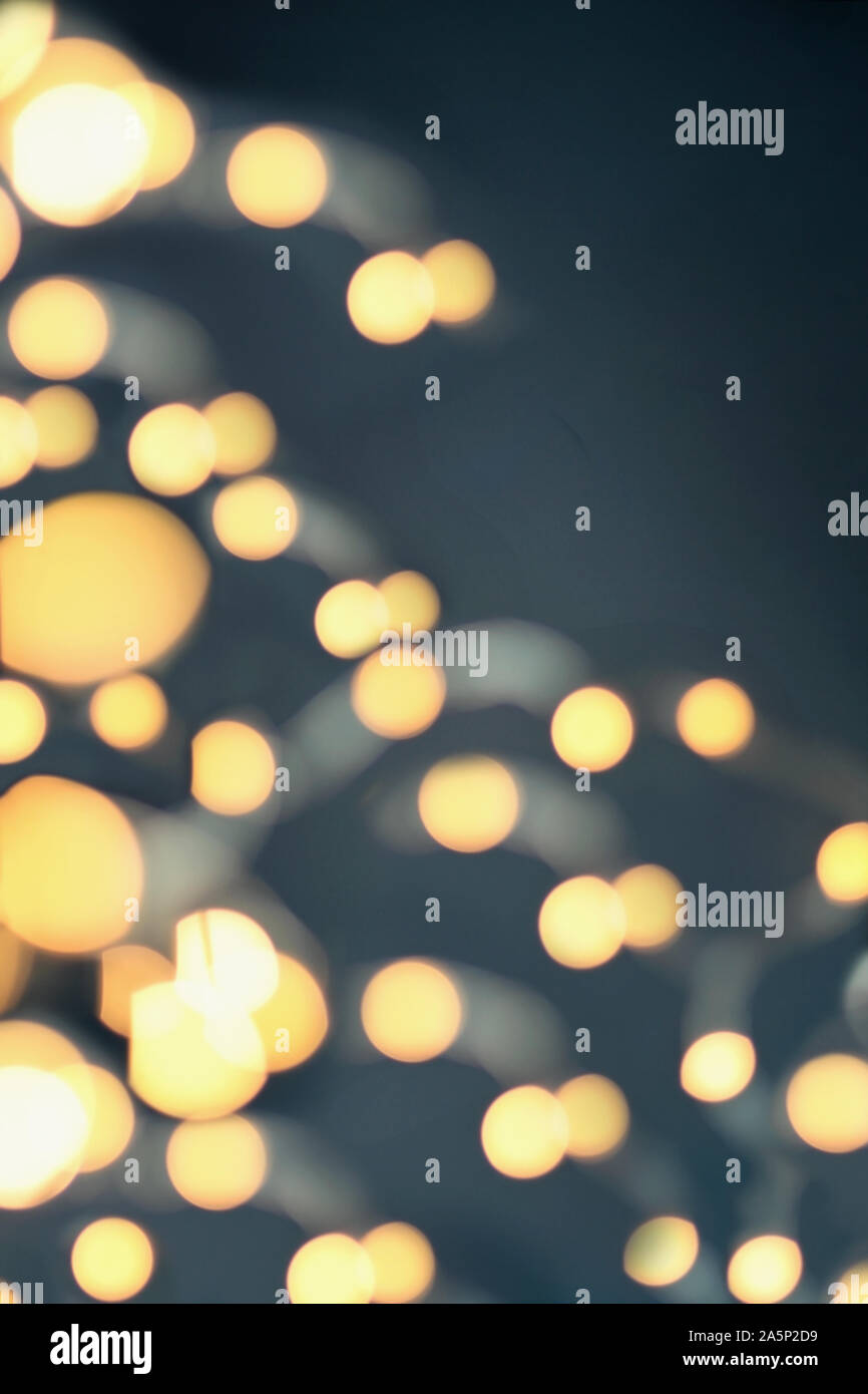 Abstract of blurred string of gold Christmas lights to use as texture ...