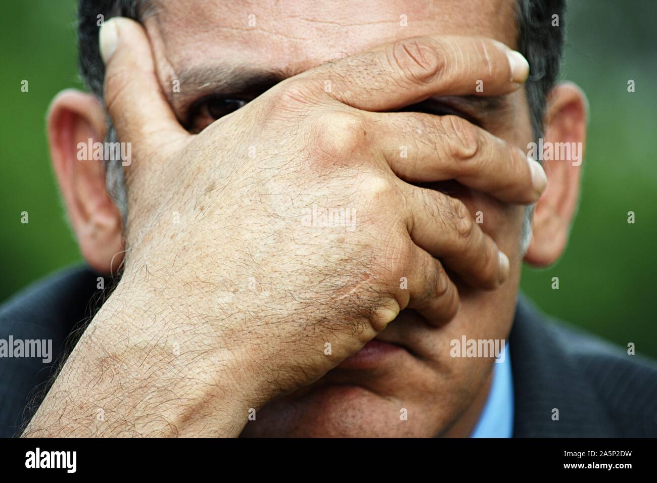 Shameful Business Man Wearing Suit And Tie Stock Photo - Alamy