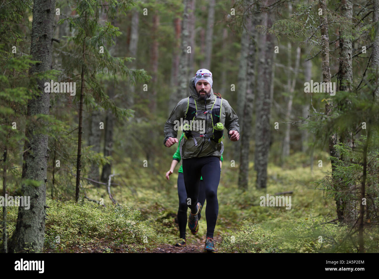 Man running in forest Stock Photo - Alamy