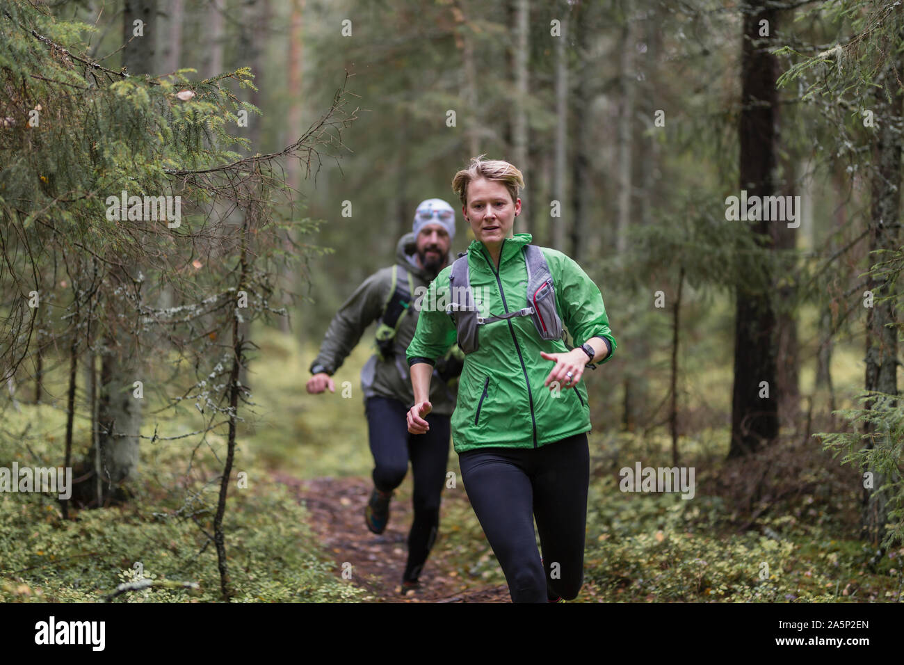 Man and woman running forward hi-res stock photography and images - Alamy