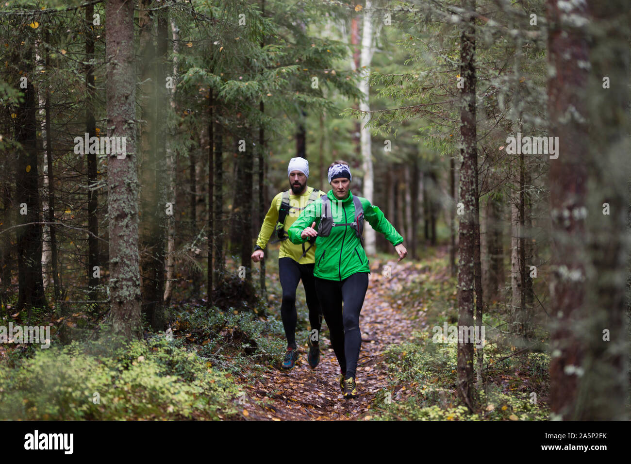 Man and woman running forward hi-res stock photography and images - Alamy