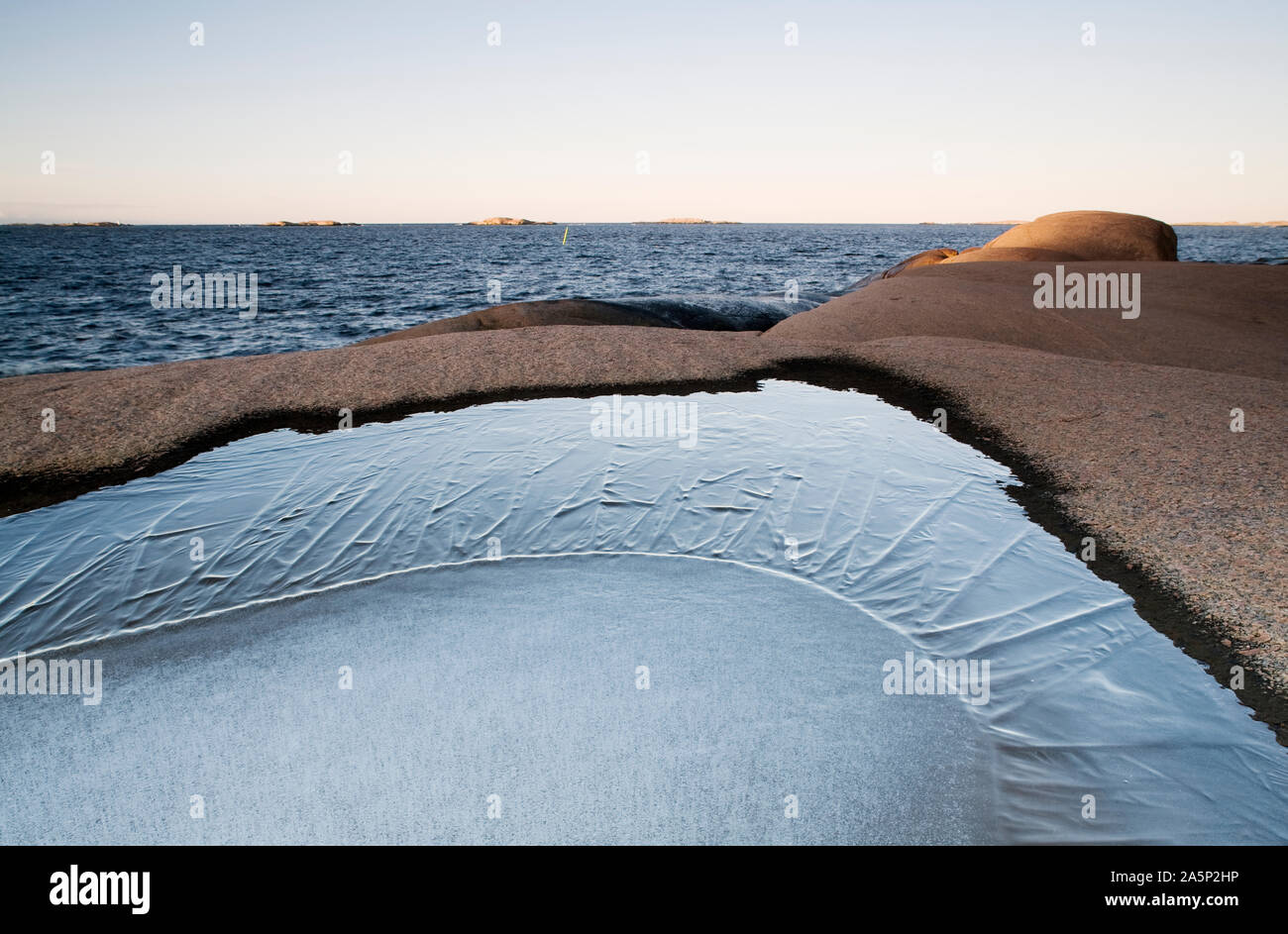 Ice on beach Stock Photo - Alamy