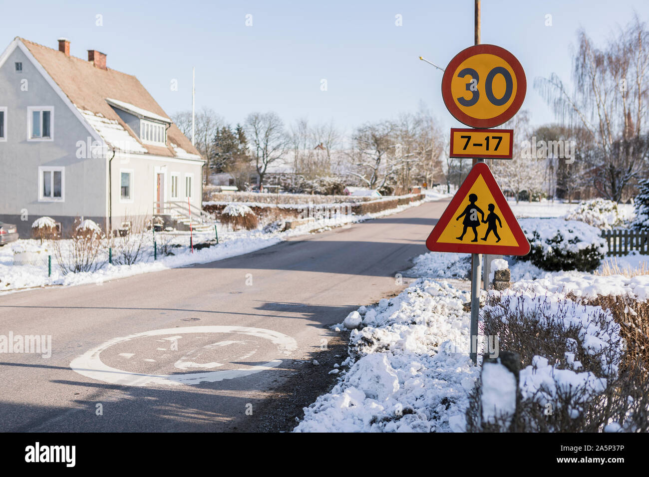 Village road with speed limit sign Stock Photo - Alamy