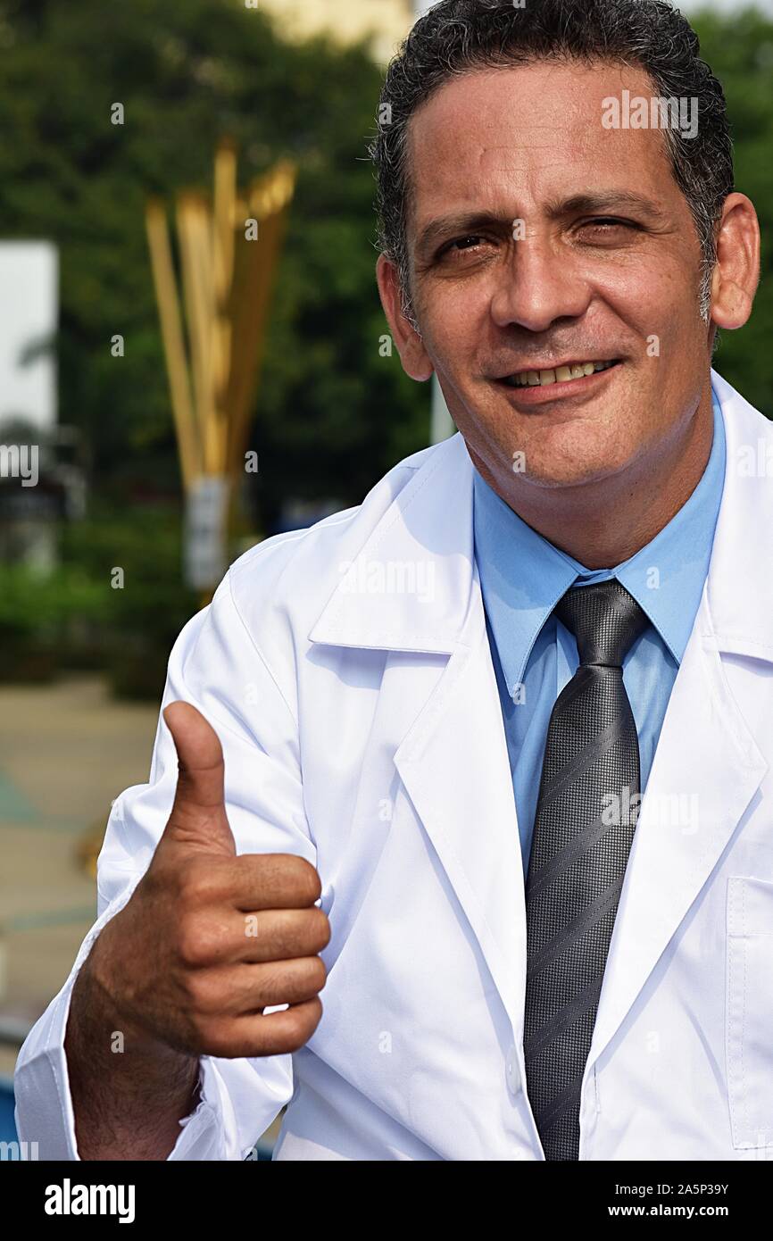 Handsome Male Doctor With Thumbs Up Wearing Lab Coat Stock Photo - Alamy