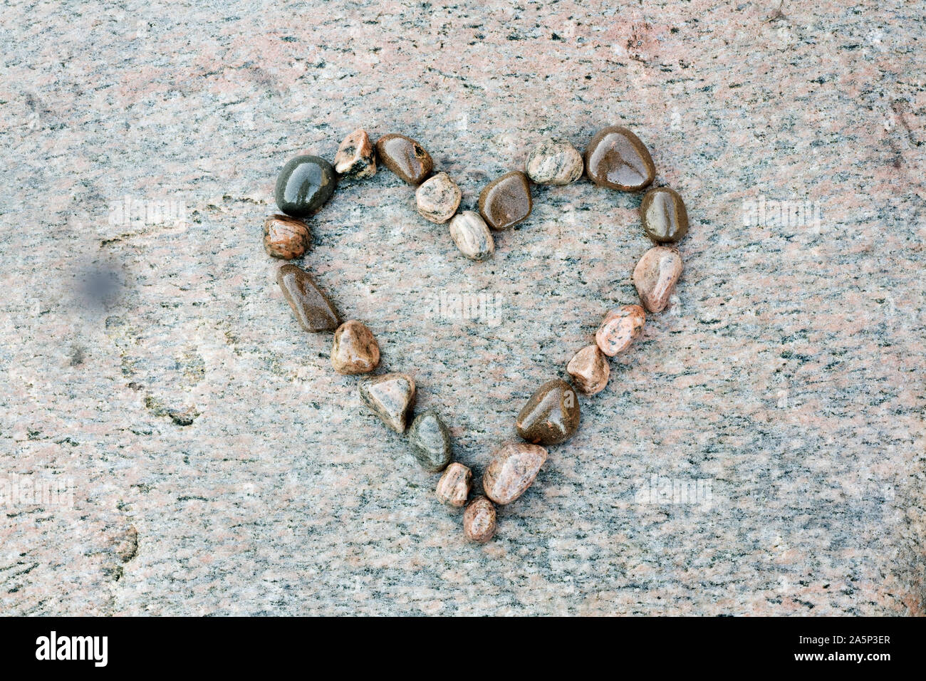 Stone heart shape Stock Photo - Alamy