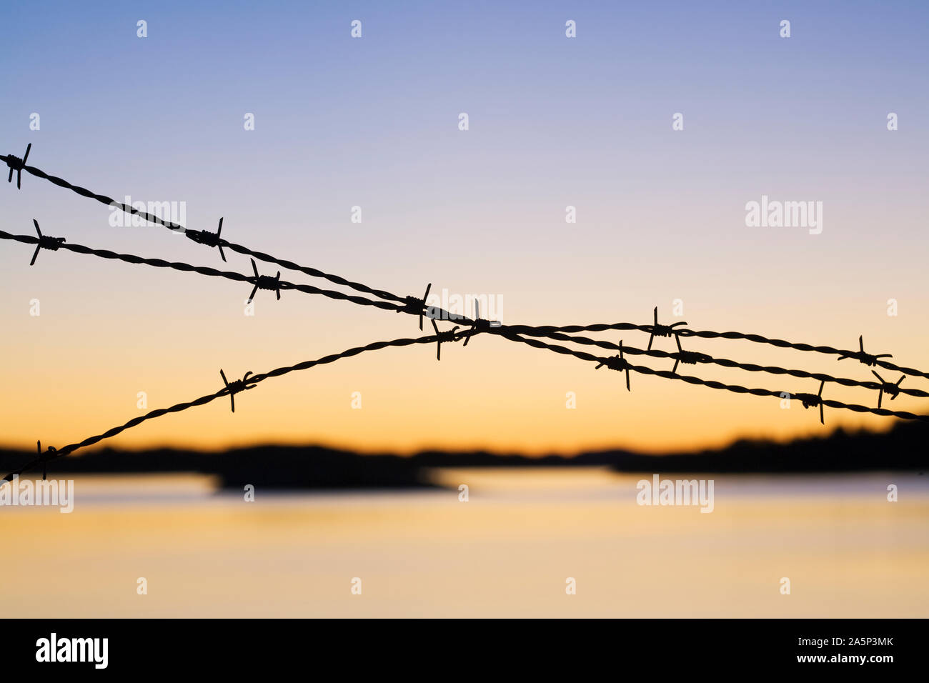 Barbed wire at sunset hi-res stock photography and images - Alamy