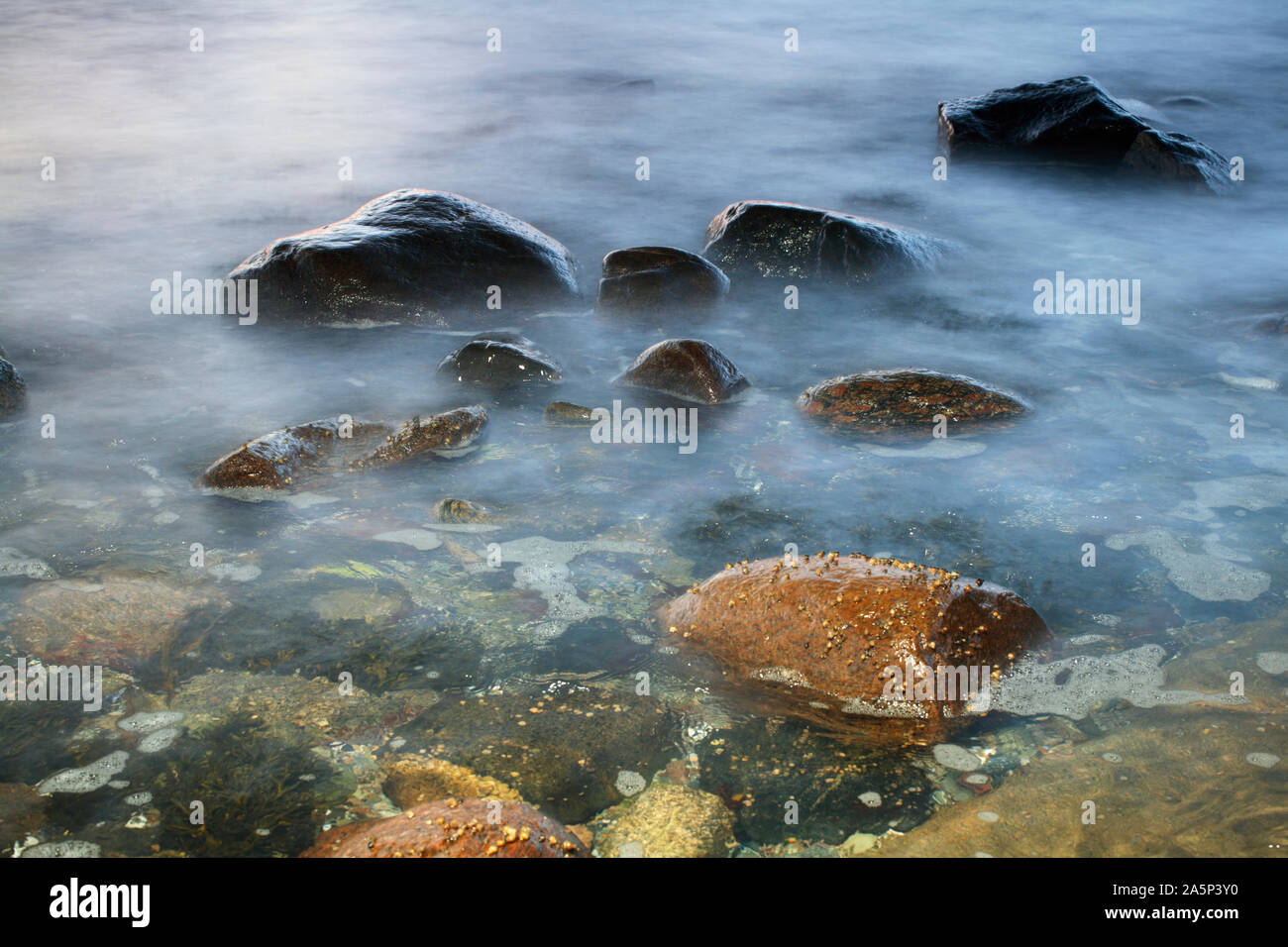 Stones in water Stock Photo - Alamy
