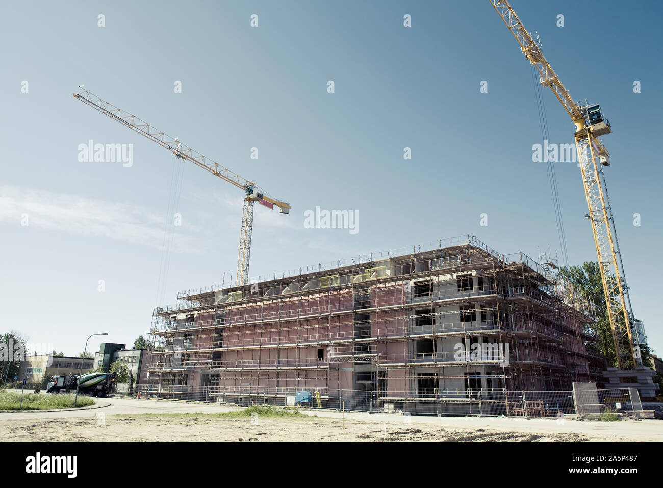 Cranes over construction site Stock Photo - Alamy