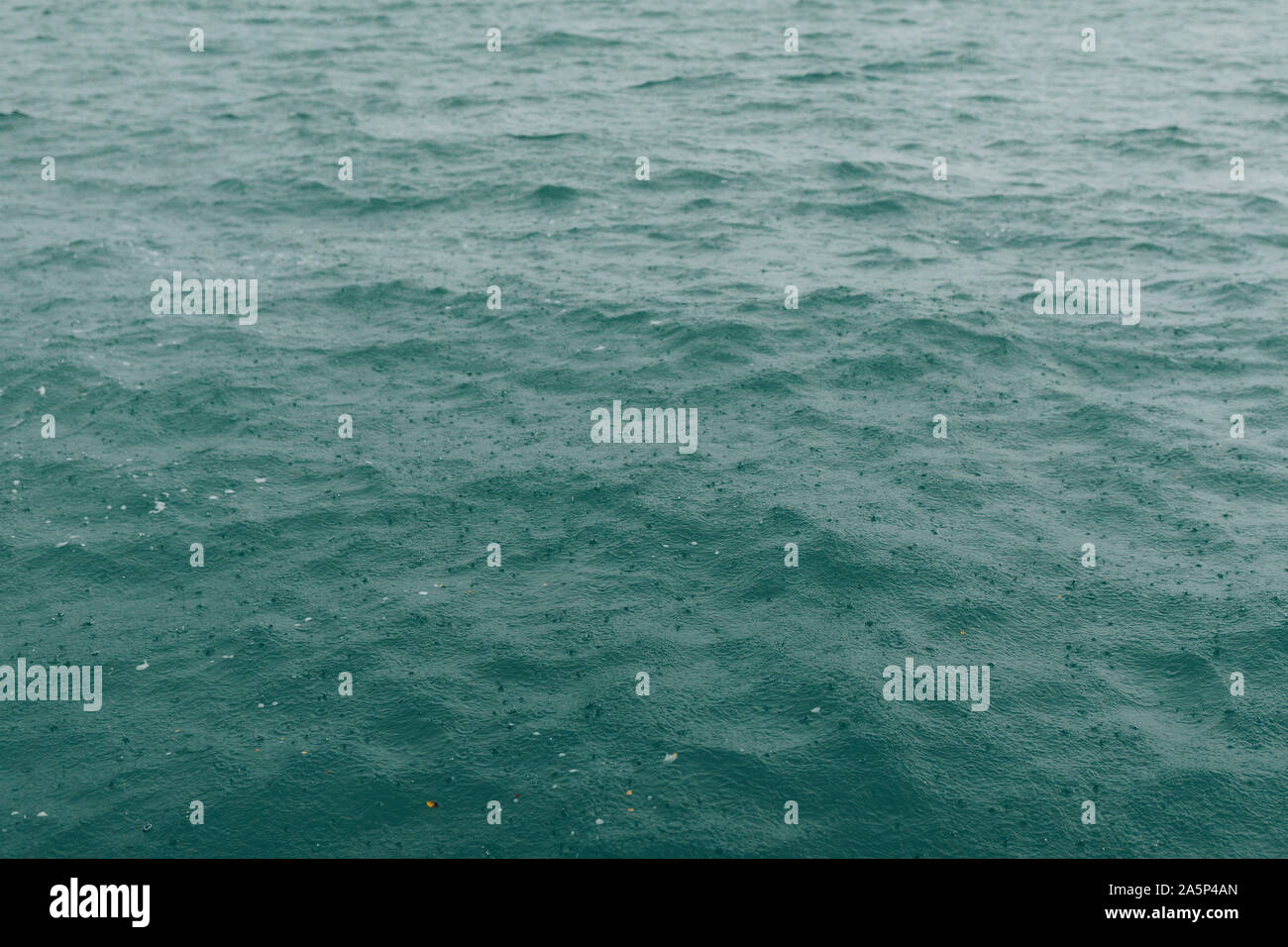 Rain on water surface Stock Photo - Alamy