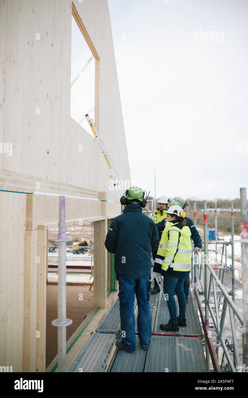 Construction workers on building site Stock Photo - Alamy