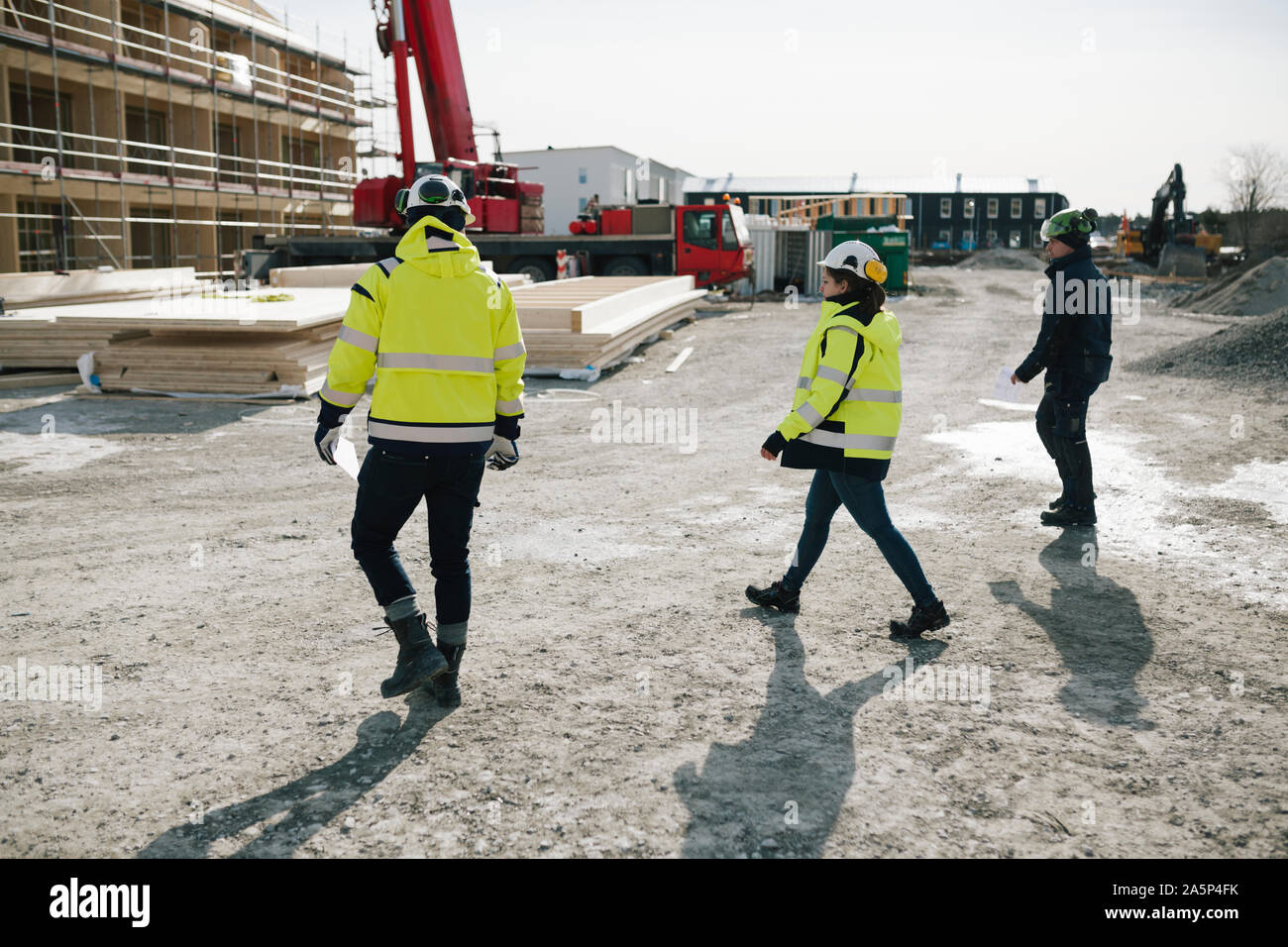 Construction workers on building site Stock Photo - Alamy