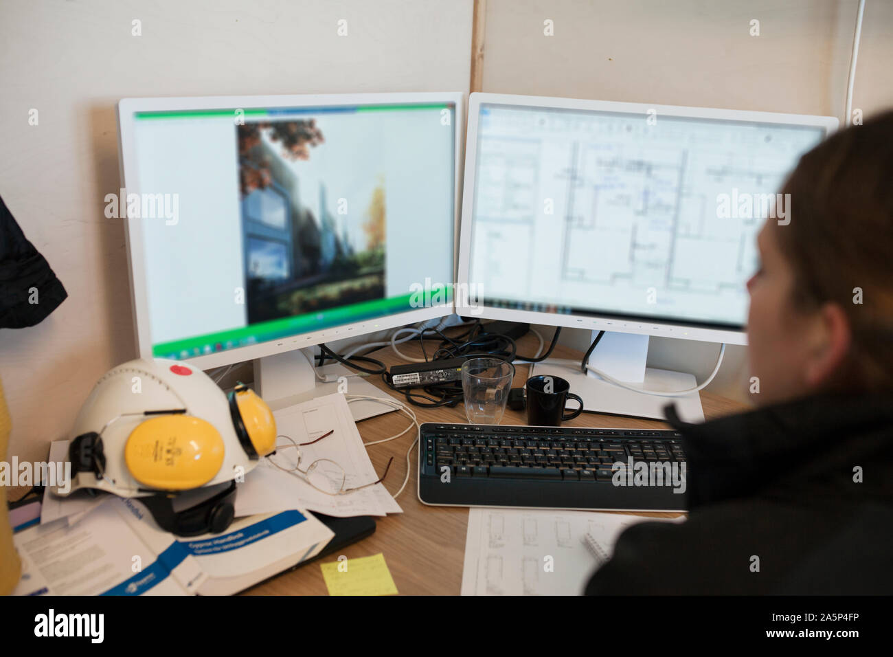 Checking building plans Stock Photo - Alamy