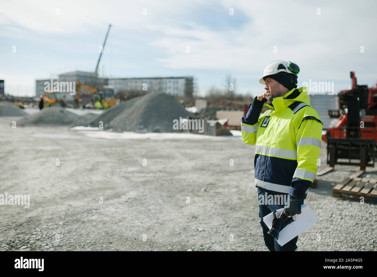 Construction worker on building site Stock Photo - Alamy