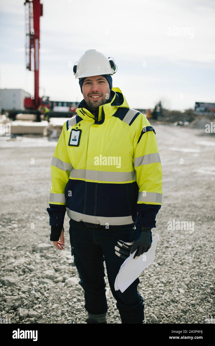 Construction worker on building site Stock Photo - Alamy