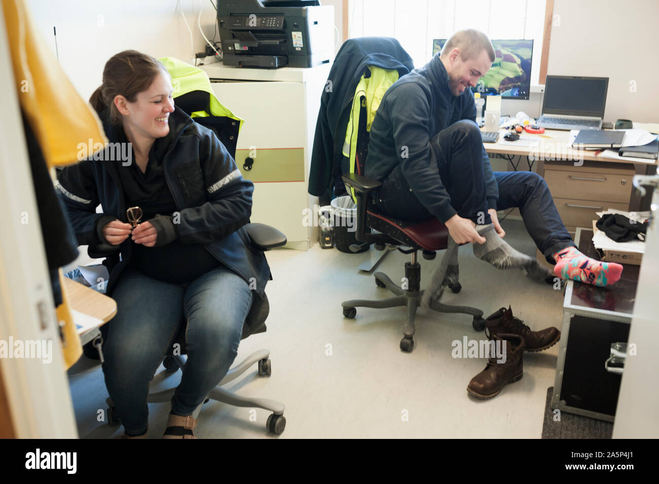 Workers in office Stock Photo - Alamy