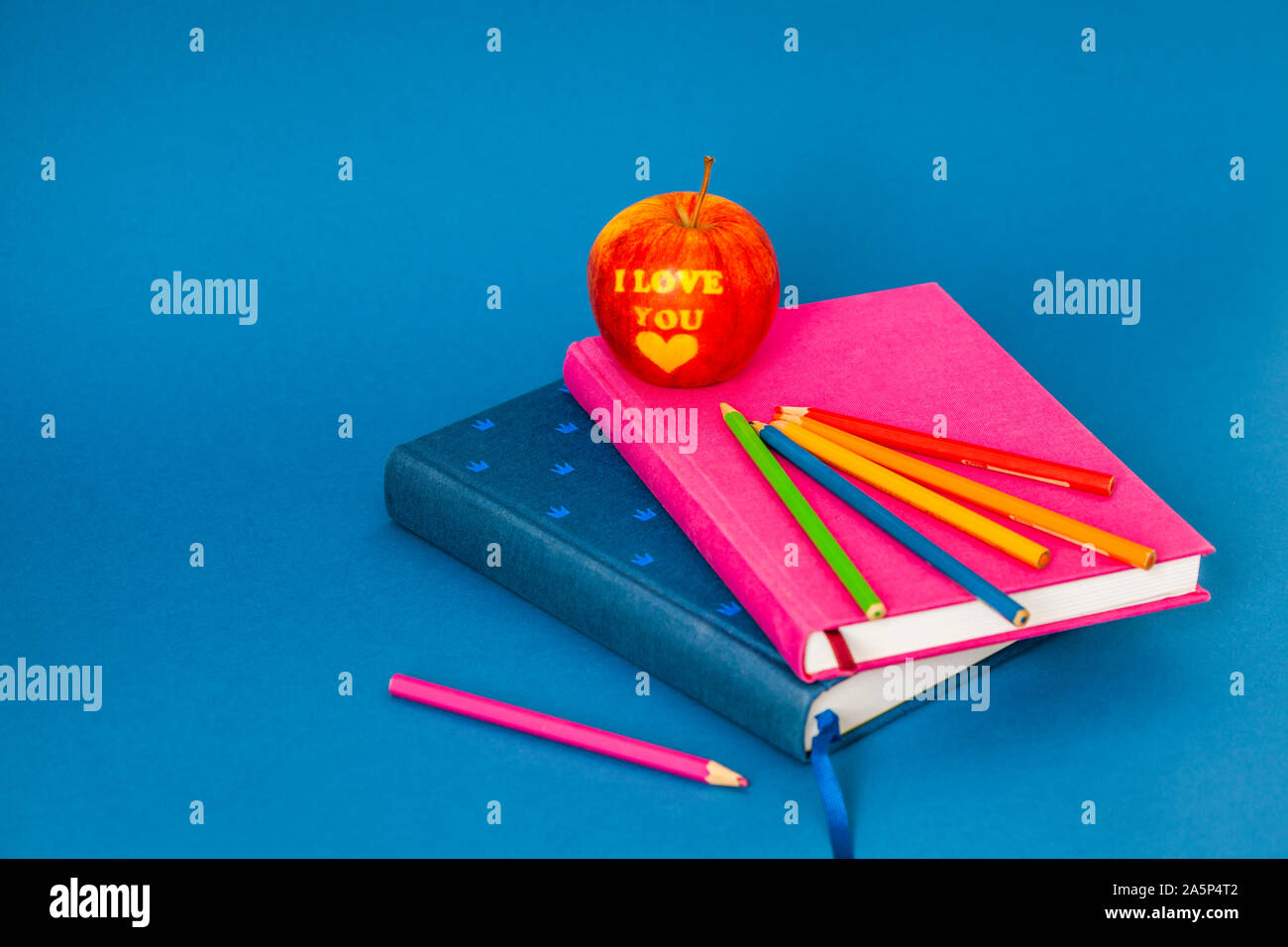 Books pencils apple on hi-res stock photography and images - Alamy