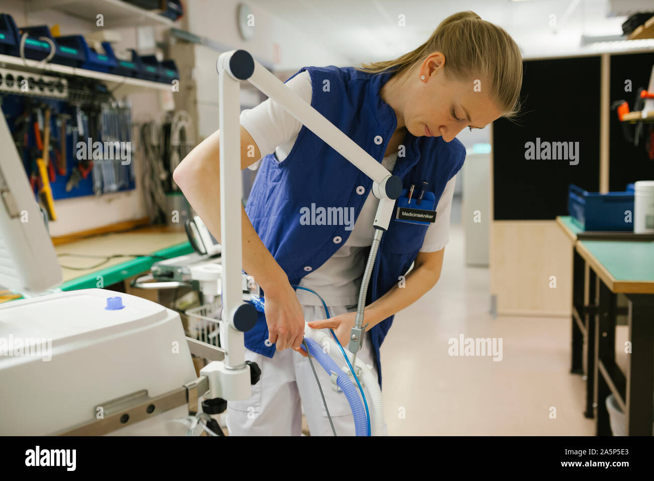 Female engineer checking hospital equipment Stock Photo - Alamy