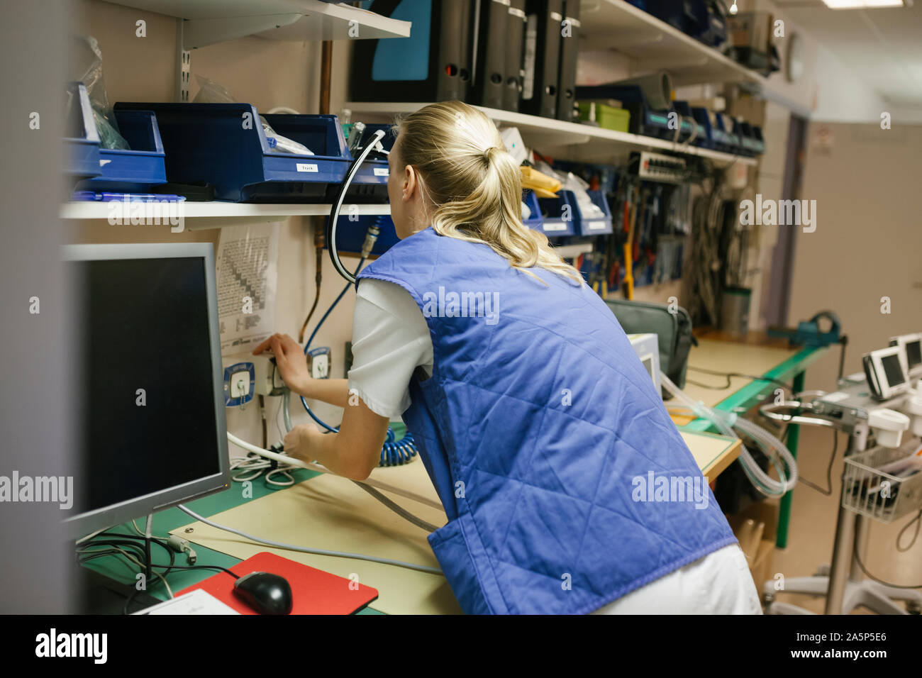 Female engineer checking hospital equipment Stock Photo - Alamy