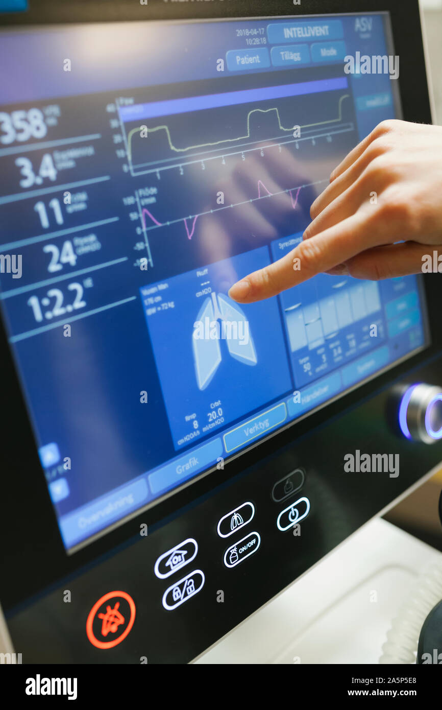 Hand on touchscreen Stock Photo - Alamy