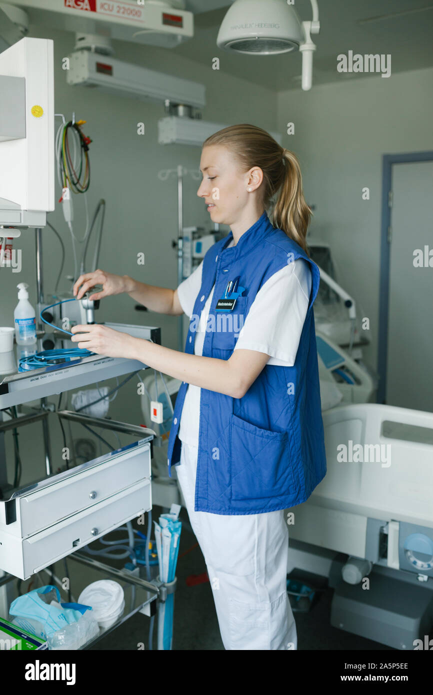 Female engineer checking hospital equipment Stock Photo - Alamy