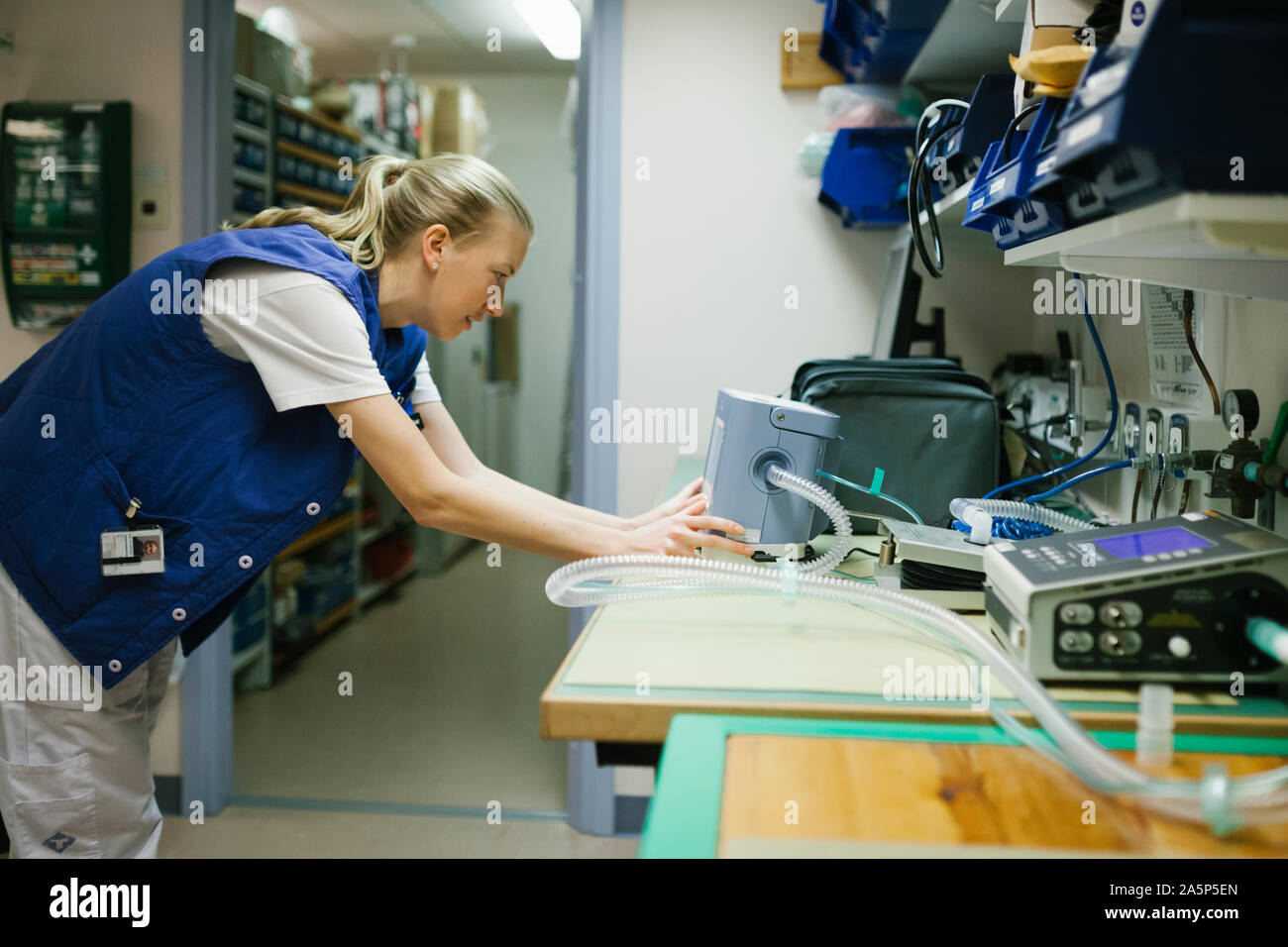Female engineer checking hospital equipment Stock Photo - Alamy