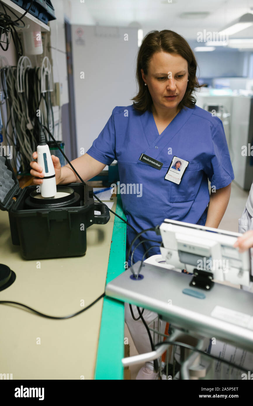 Female engineer checking hospital equipment Stock Photo - Alamy