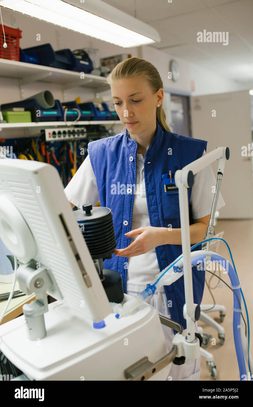 Female engineer checking hospital equipment Stock Photo - Alamy