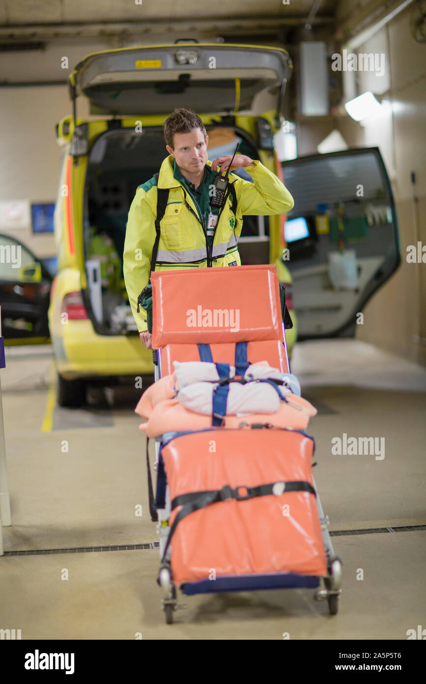 Paramedic with stretcher Stock Photo - Alamy