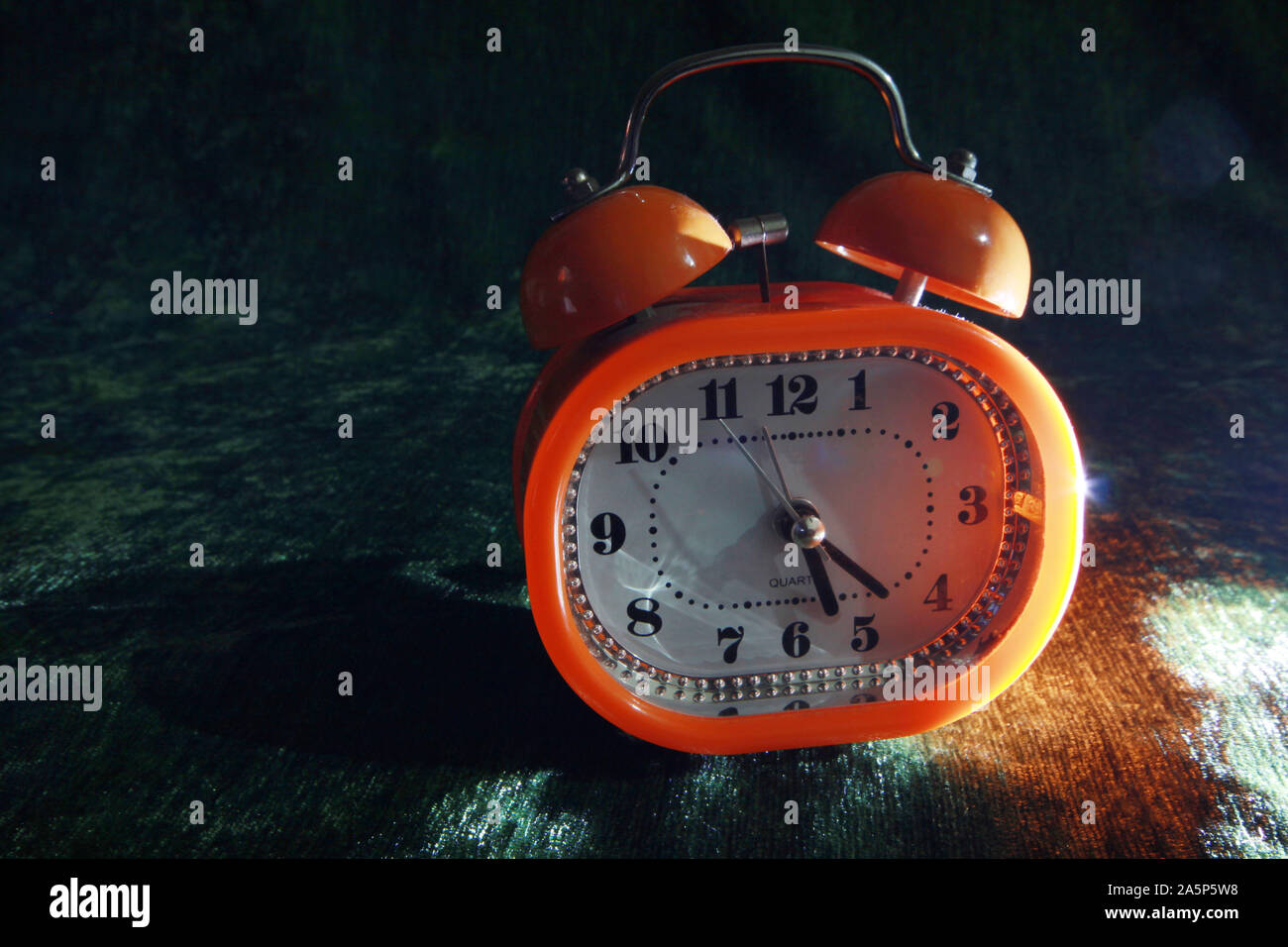 Alarm clock on fabric hi-res stock photography and images - Alamy