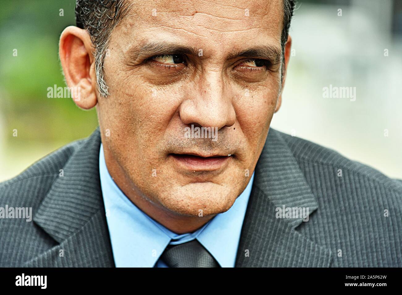 Suspicious Business Executive Stock Photo - Alamy