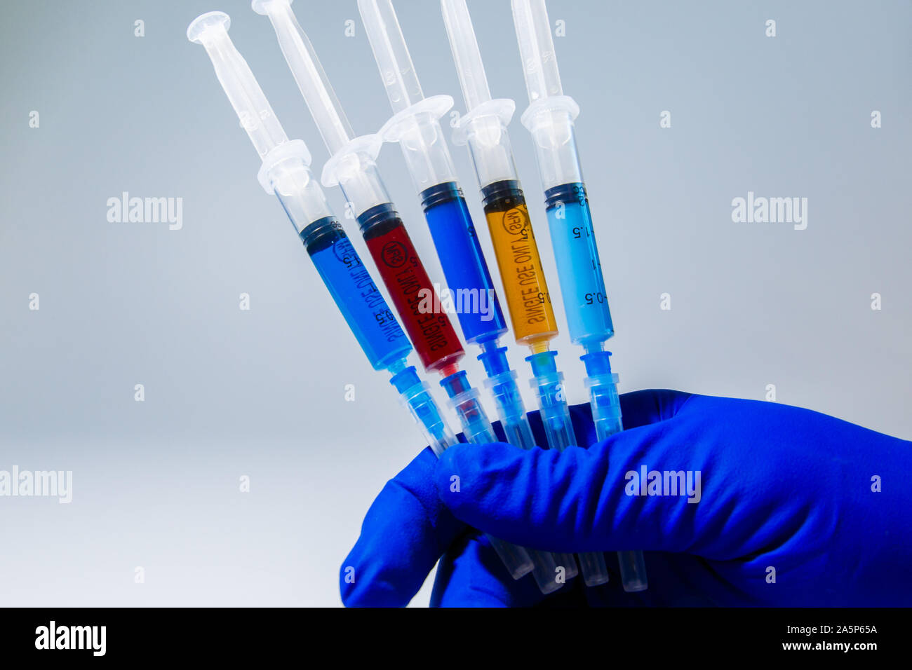 Medical syringes with colorful injections for cosmetology. Syringes ...