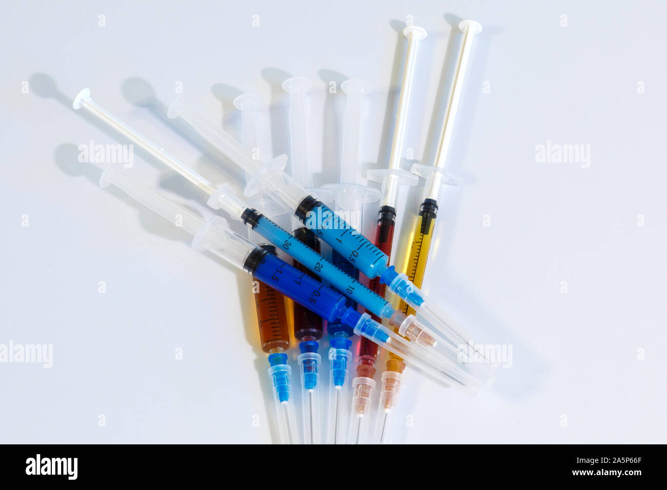 Medical syringes with colorful injections for cosmetology. Syringes ...
