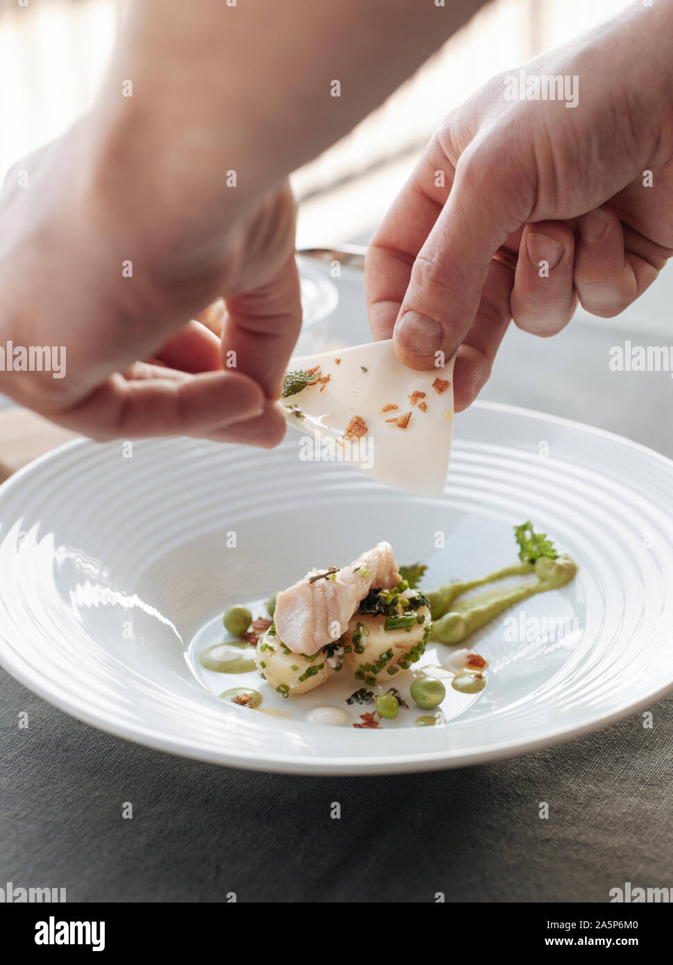 Putting food on plate Stock Photo - Alamy