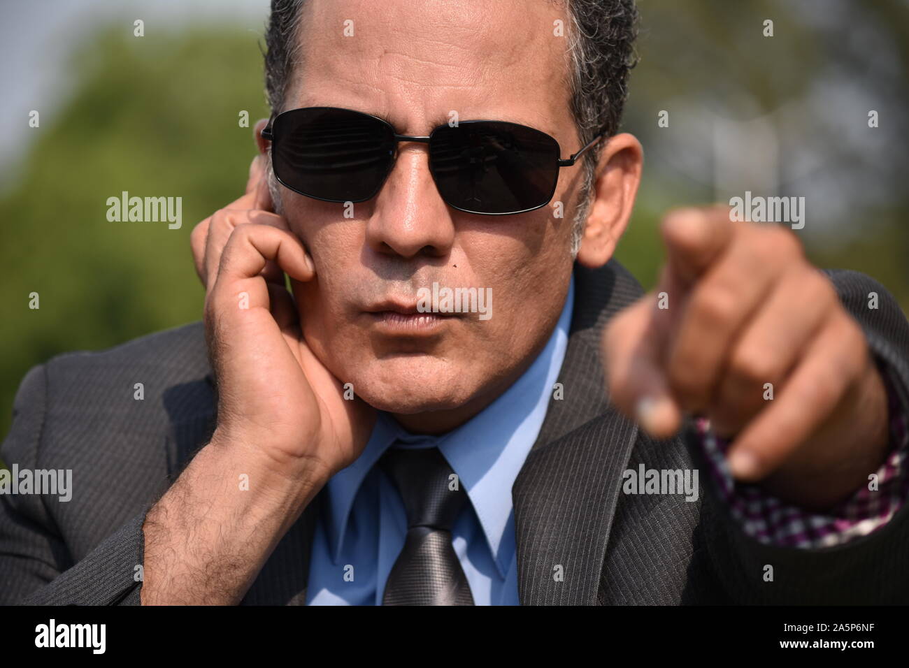Pointing Diverse Security Guard Wearing Business Suit Stock Photo - Alamy