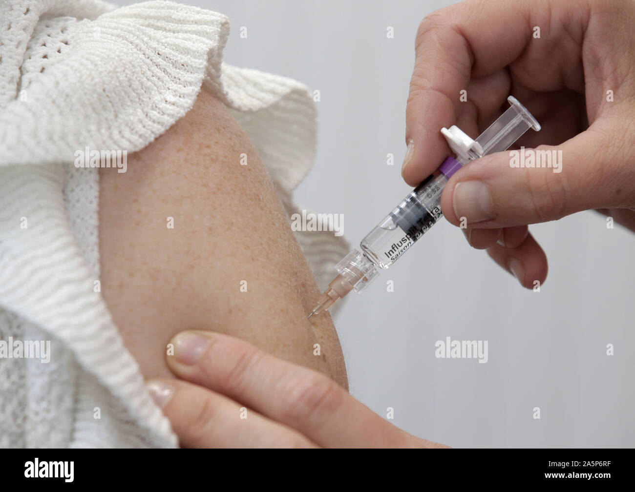 Munich, Germany. 22nd Oct, 2019. A physician inoculates a patient with ...