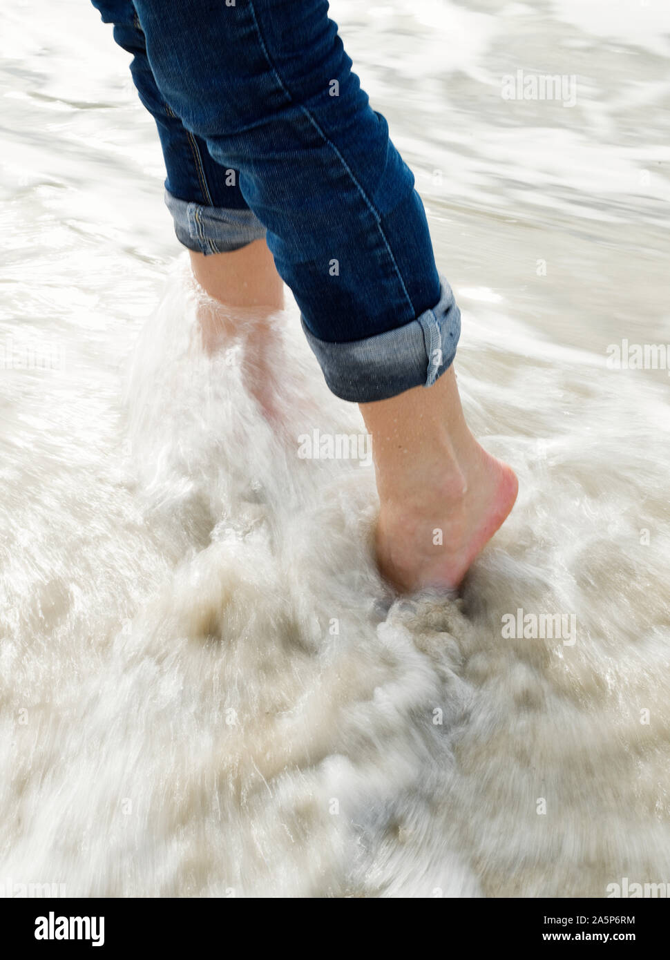 Standing in sea Stock Photo - Alamy