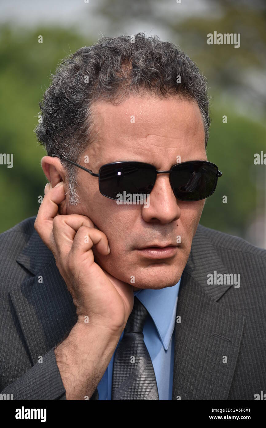 Security Guard Hearing Wearing Suit And Tie Stock Photo - Alamy