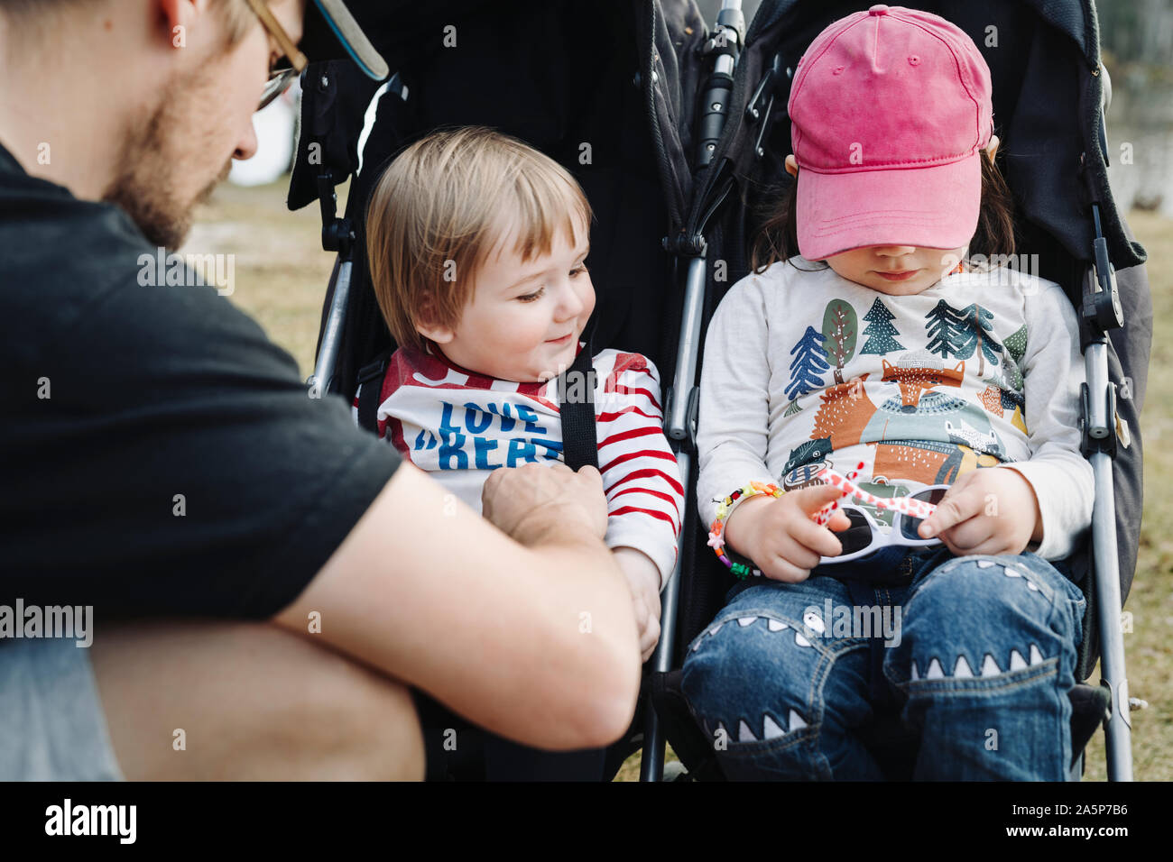 Children with pram hi-res stock photography and images - Alamy