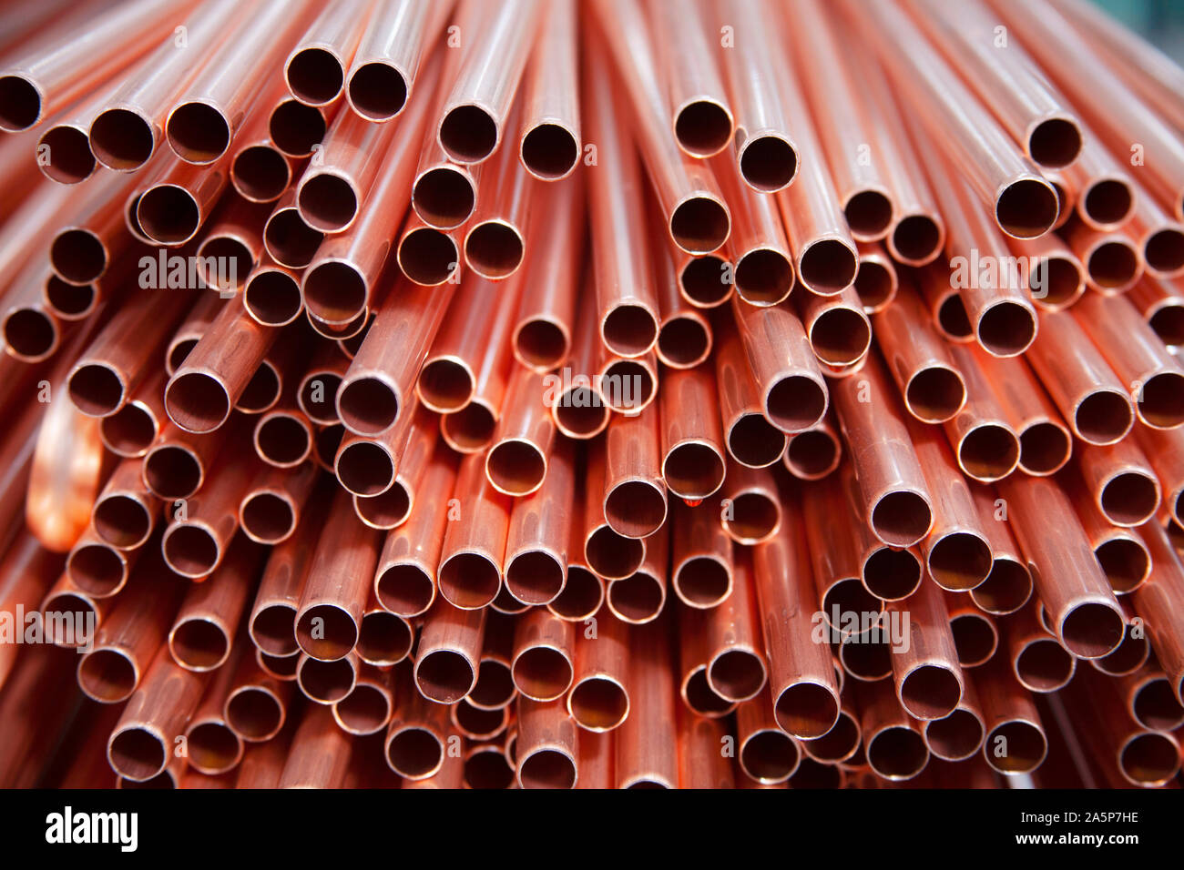 Copper pipes in factory, industrial background Stock Photo - Alamy