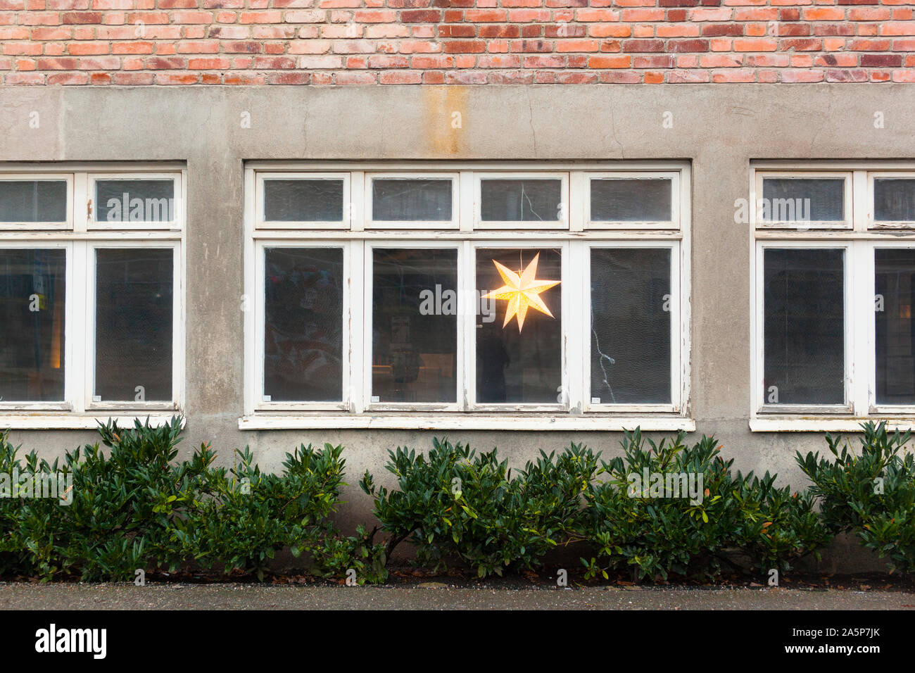 Window with illuminated star Stock Photo - Alamy