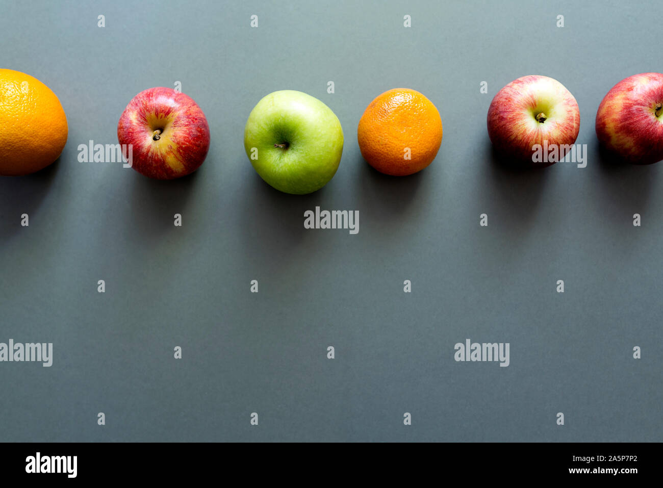 Fruits on grey background Stock Photo - Alamy