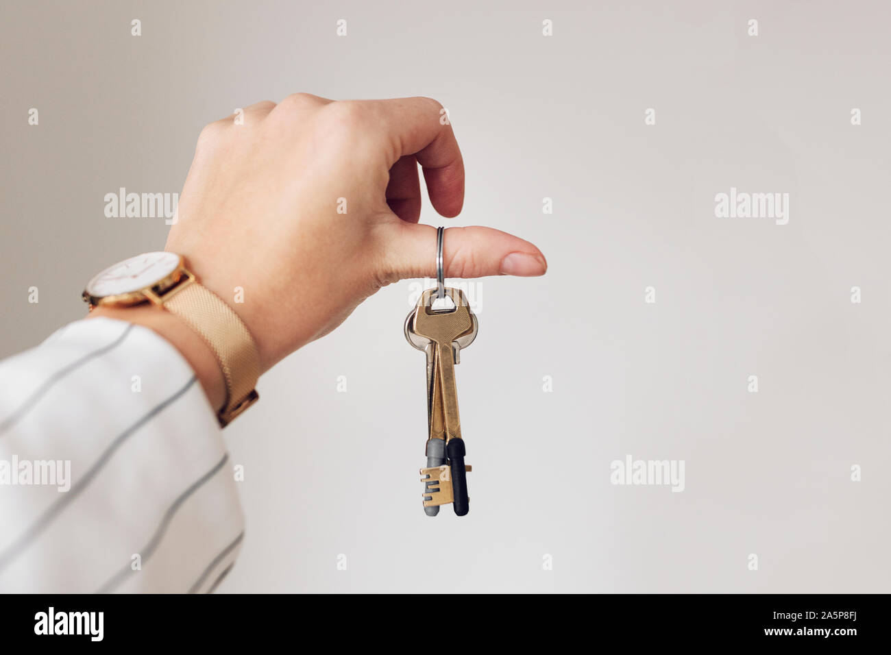 Hand with keys Stock Photo - Alamy