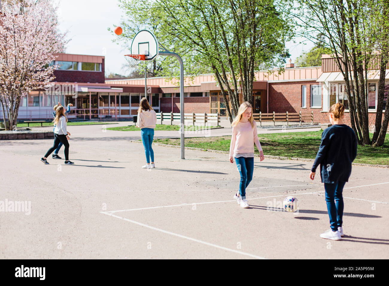 Kids on school courtyard Stock Photo - Alamy