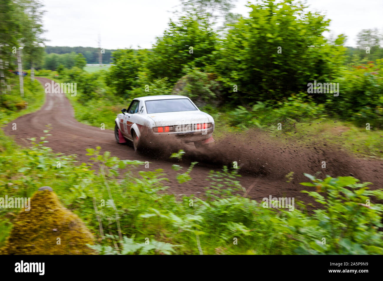 Car driving on dirt track Stock Photo - Alamy