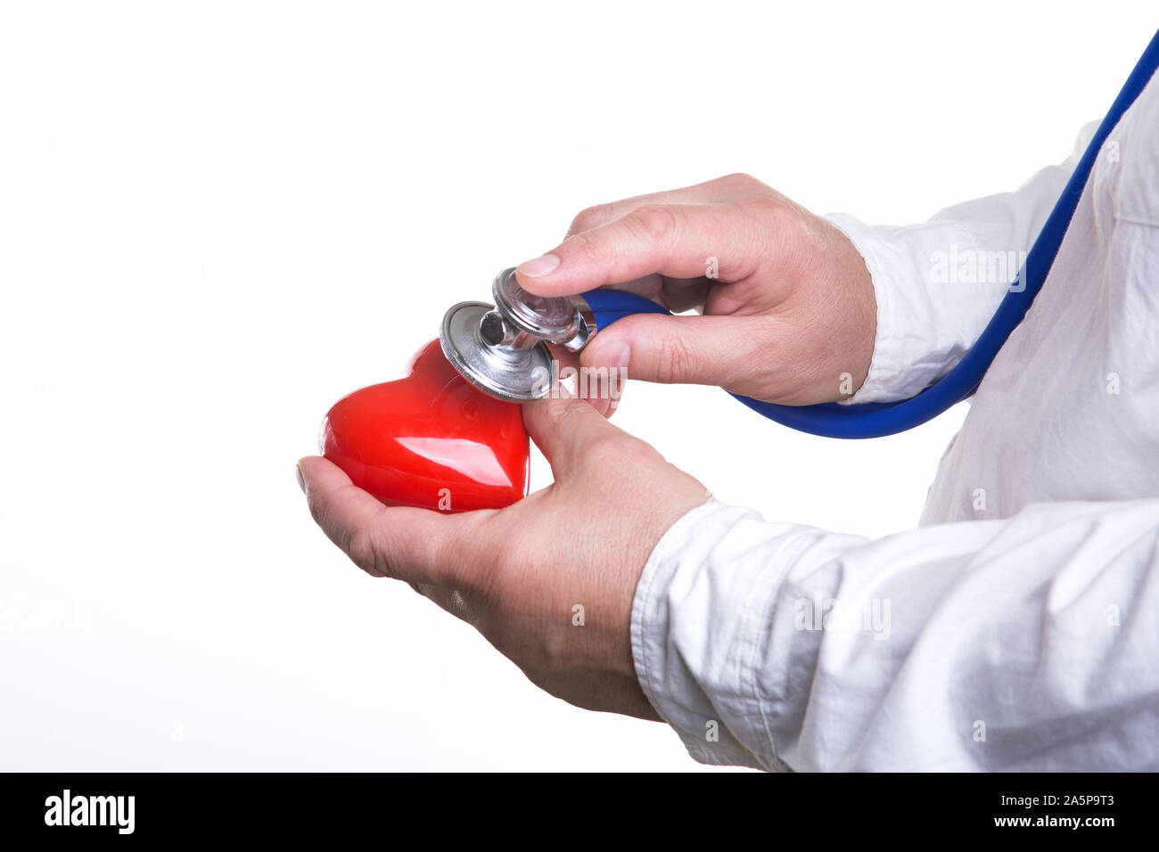 young mail doctor holding red heart in his hand Stock Photo - Alamy